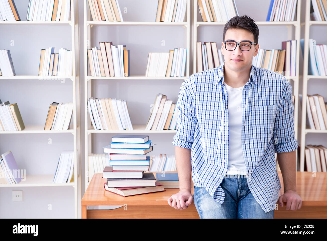 Young student with books preparing for exams Stock Photo - Alamy