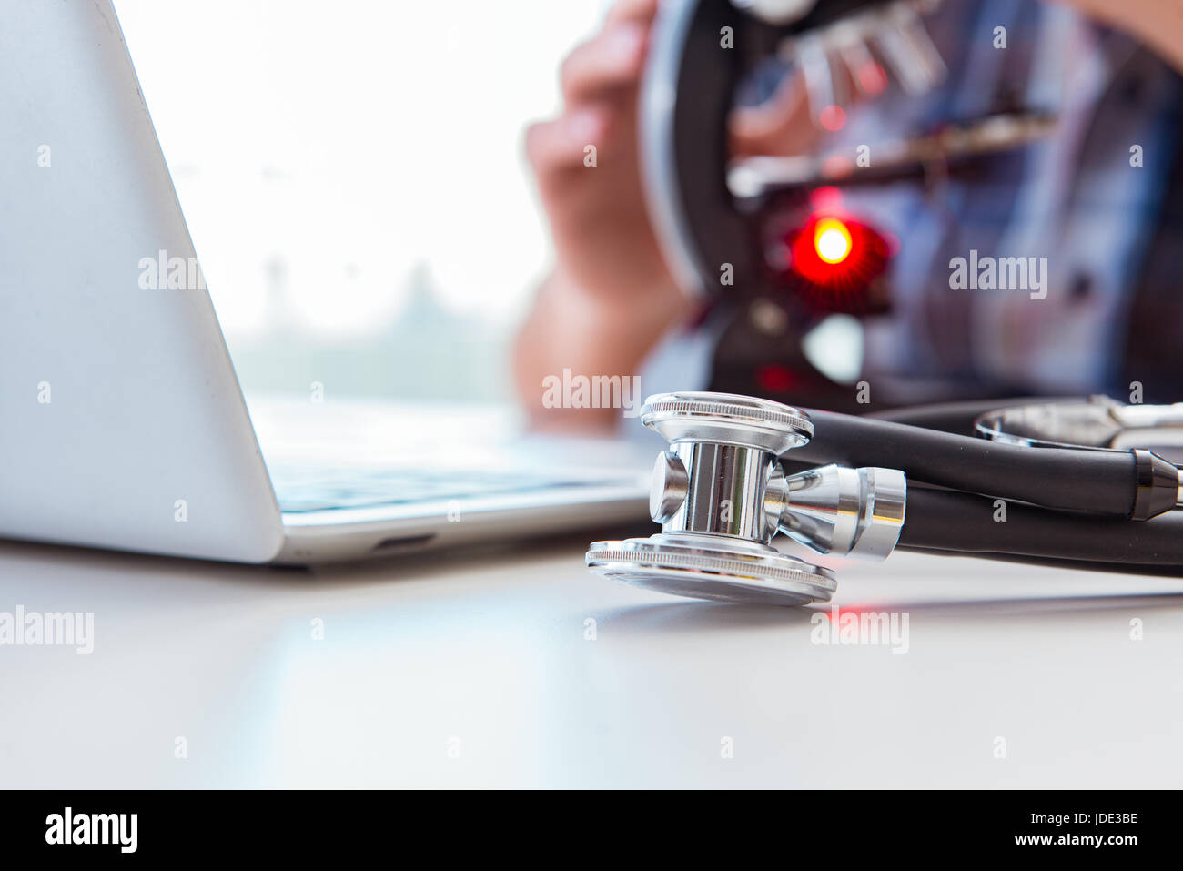 High precision engineering with man working with microscope Stock Photo ...