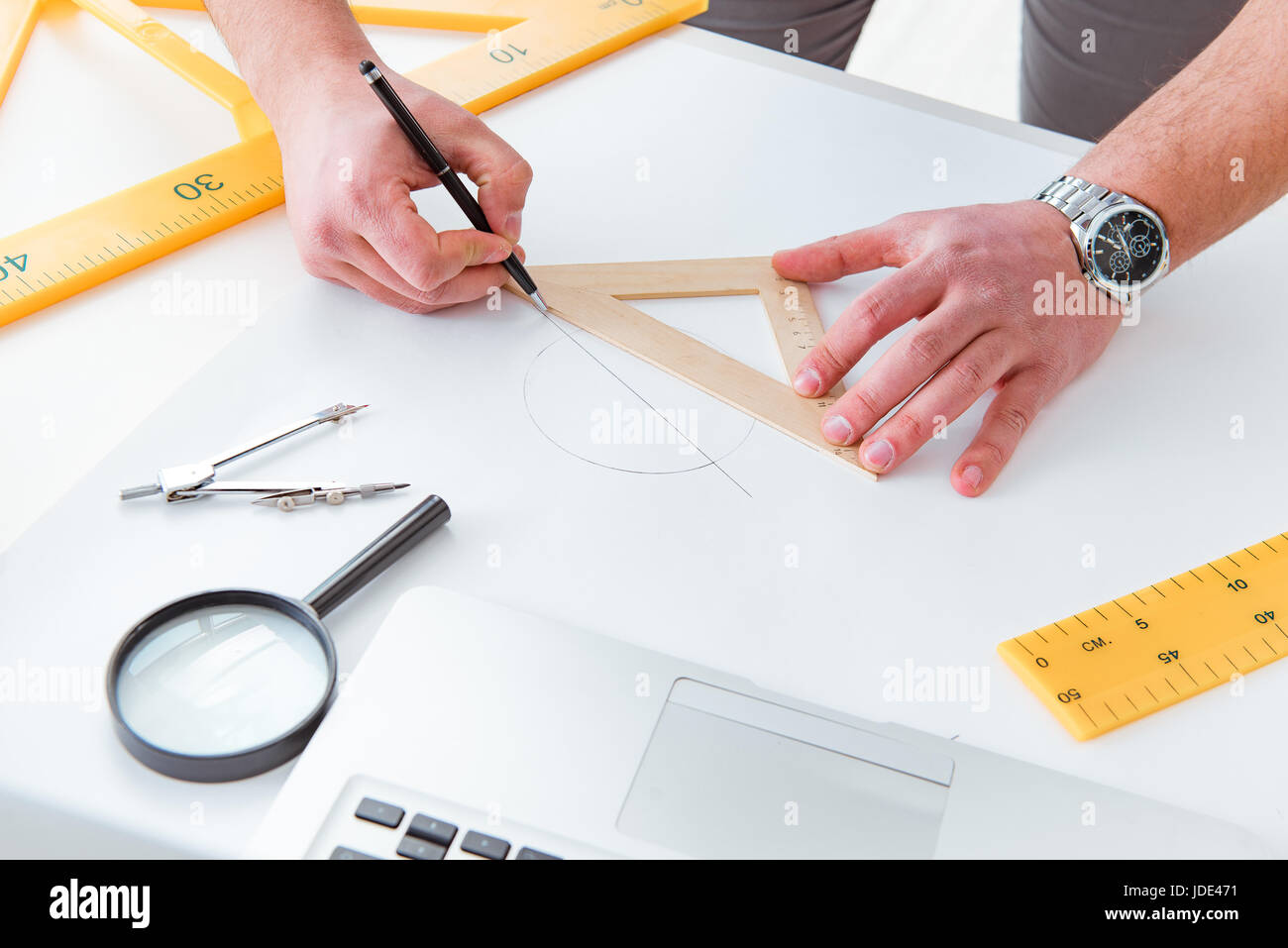 Male engineer working on drawings and blueprints Stock Photo - Alamy