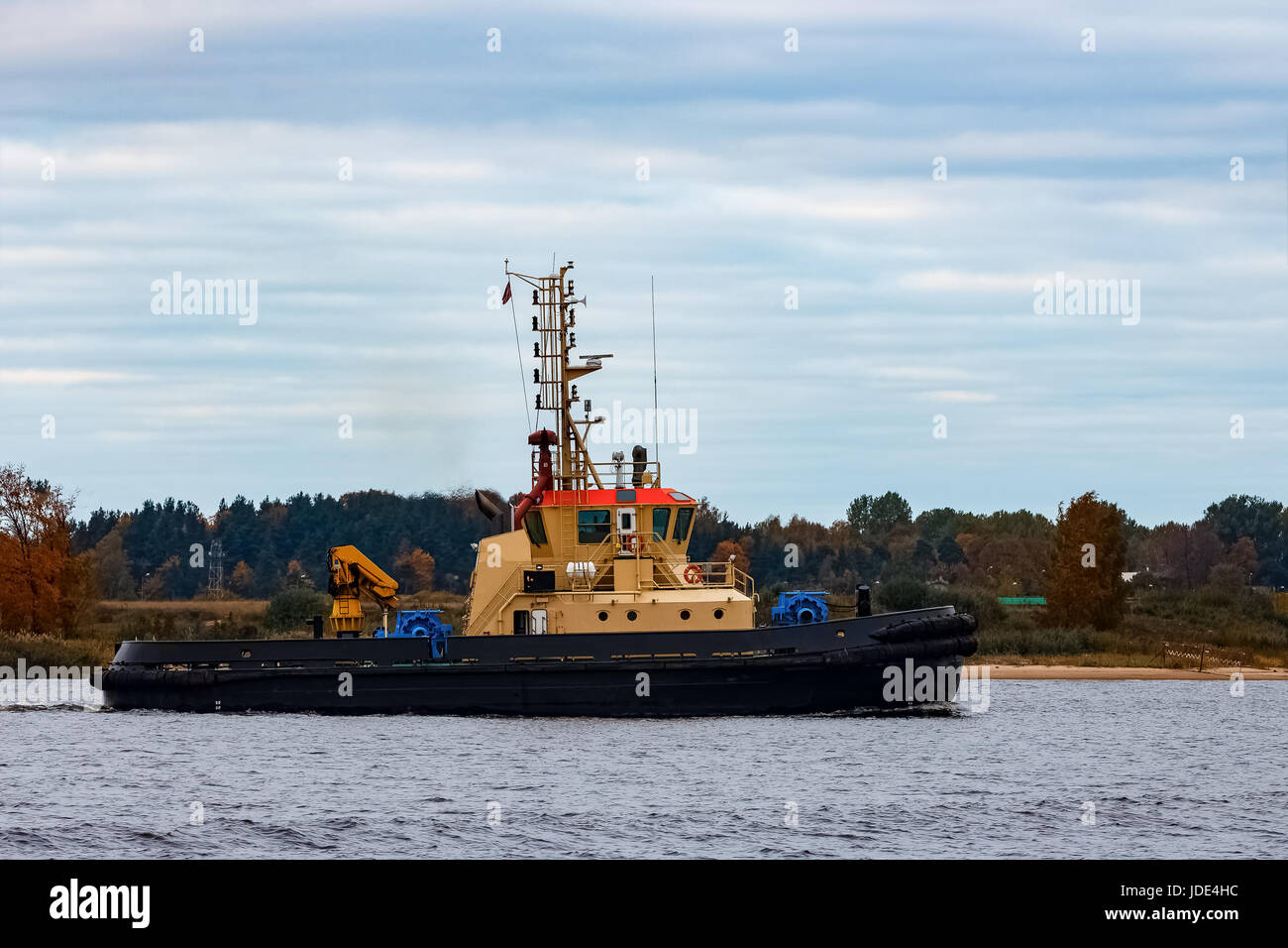 Tug ship in the cargo port of Riga, Europe Stock Photo - Alamy
