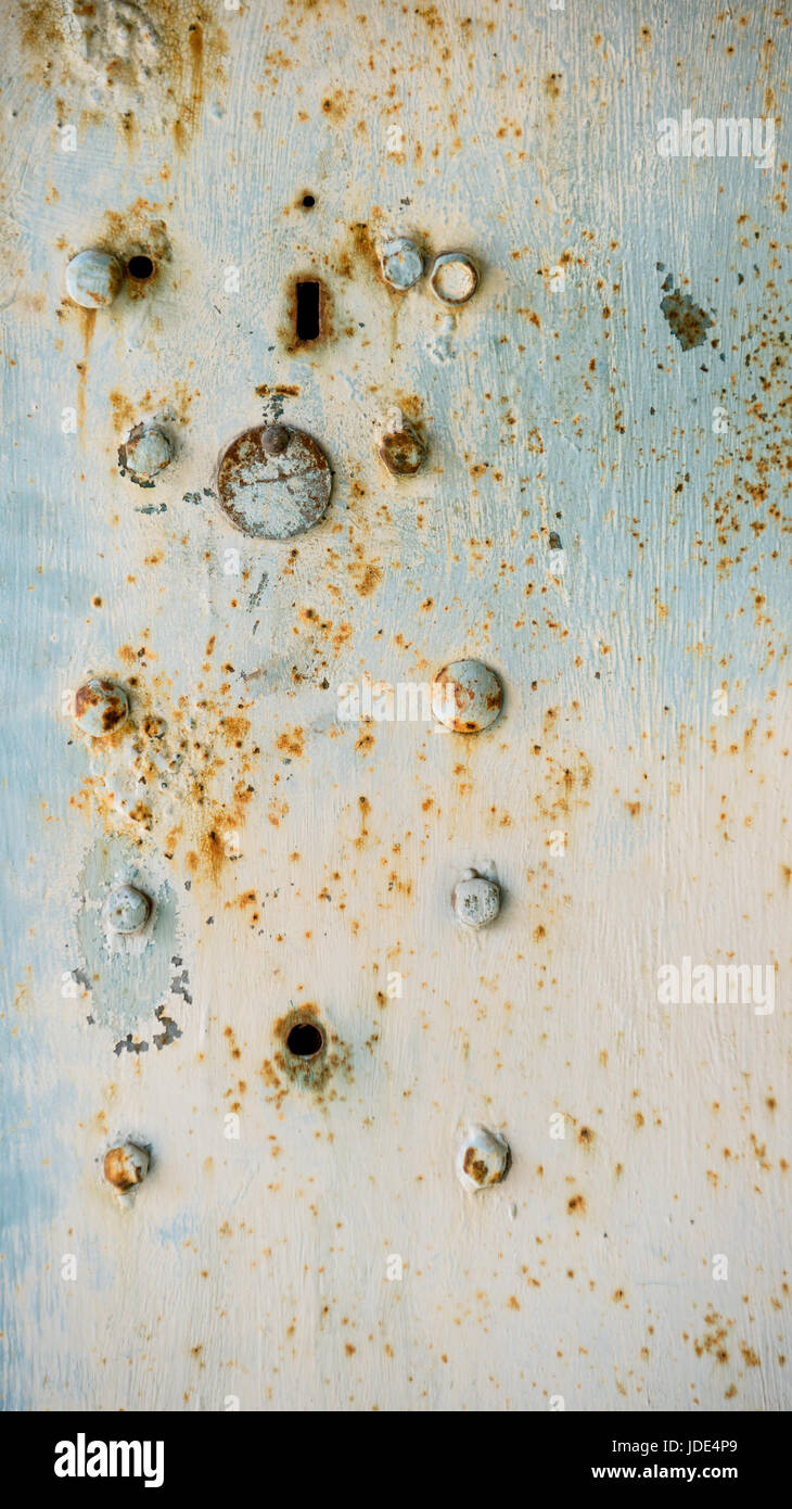 abstract background with holes and screws, and the texture of the rust ...