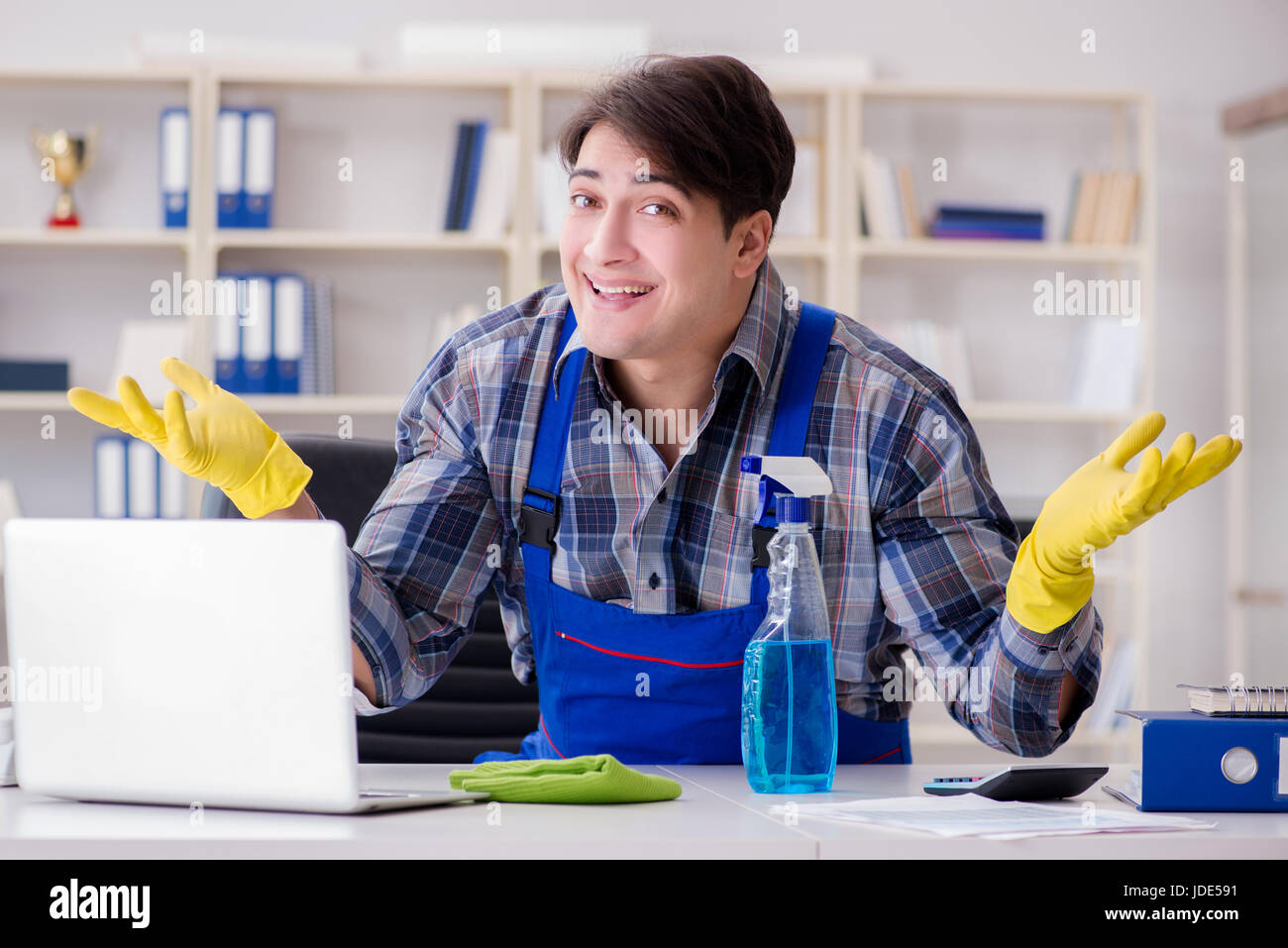 Male cleaner working in the office Stock Photo - Alamy