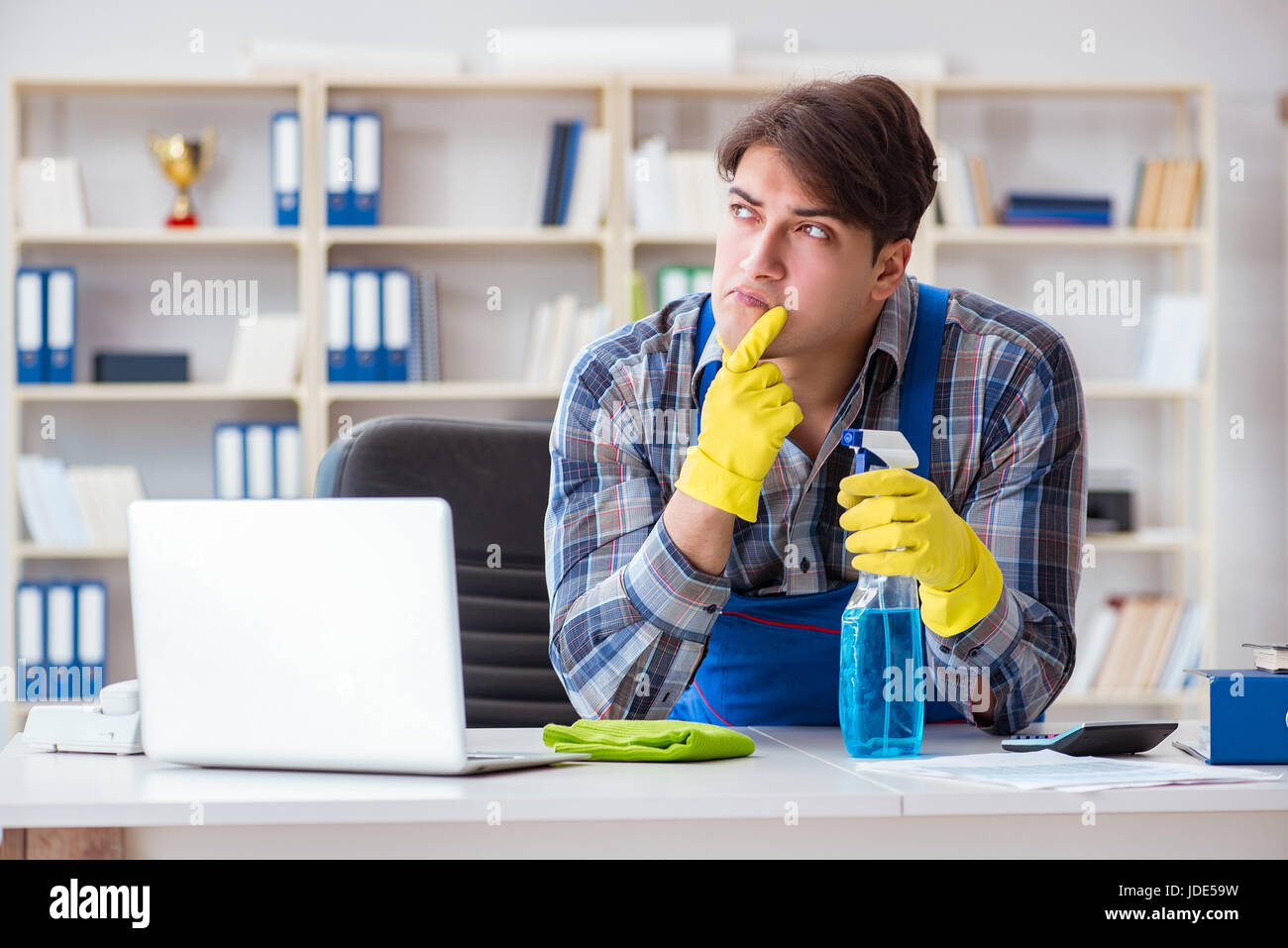 Tired male cleaner mopping hi-res stock photography and images - Alamy