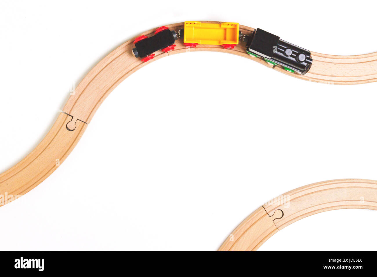 Toy train and wooden rails on white background. Top view Stock Photo ...