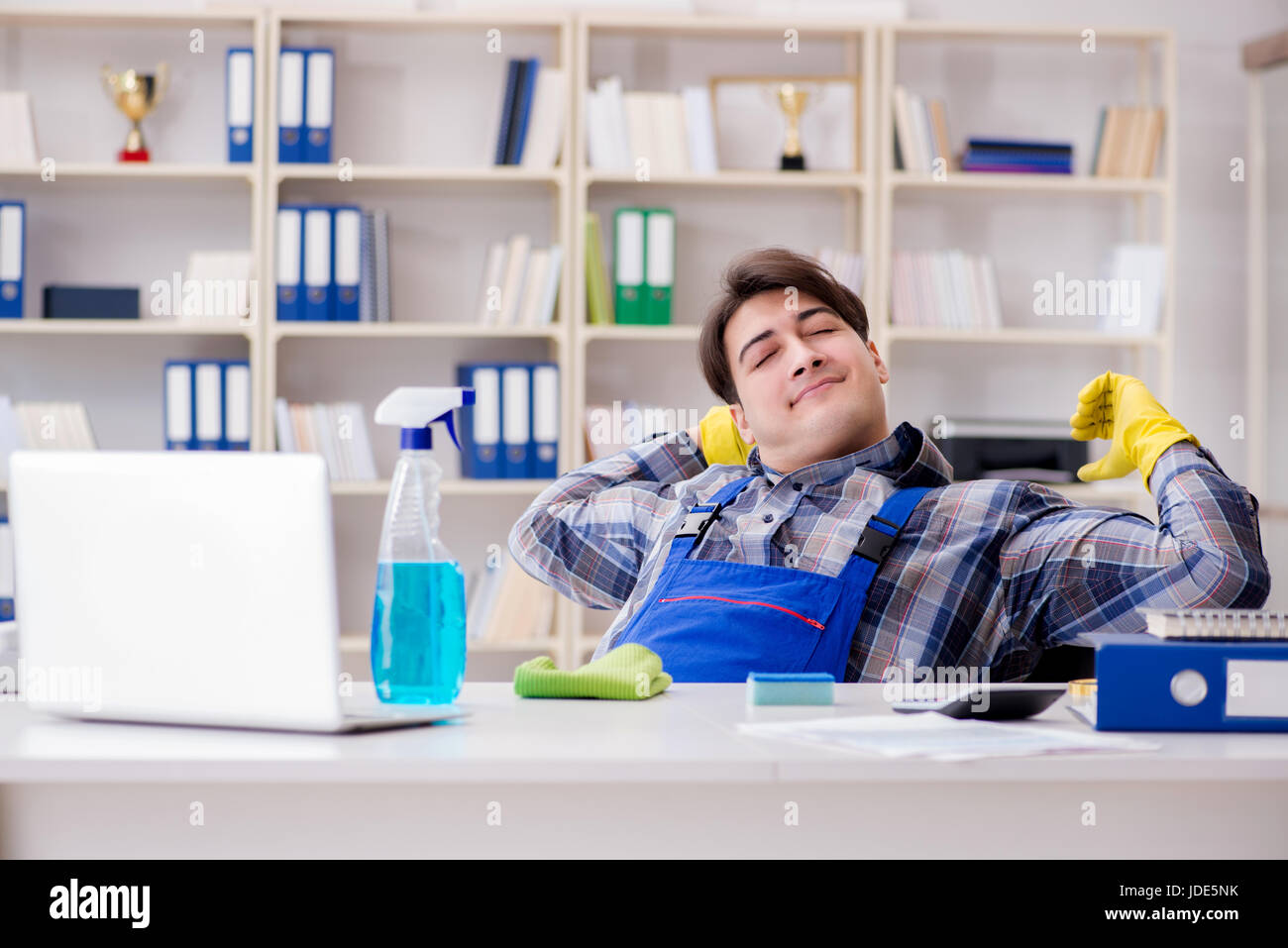 Male cleaner working in the office Stock Photo - Alamy
