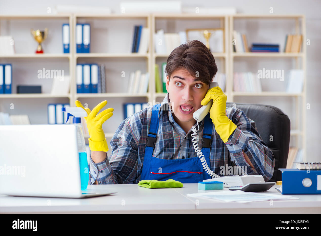 Male cleaner working in the office Stock Photo - Alamy