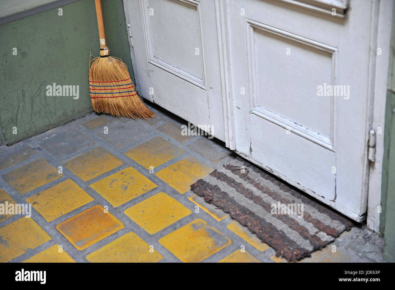 Broom at the door inside the house Stock Photo - Alamy