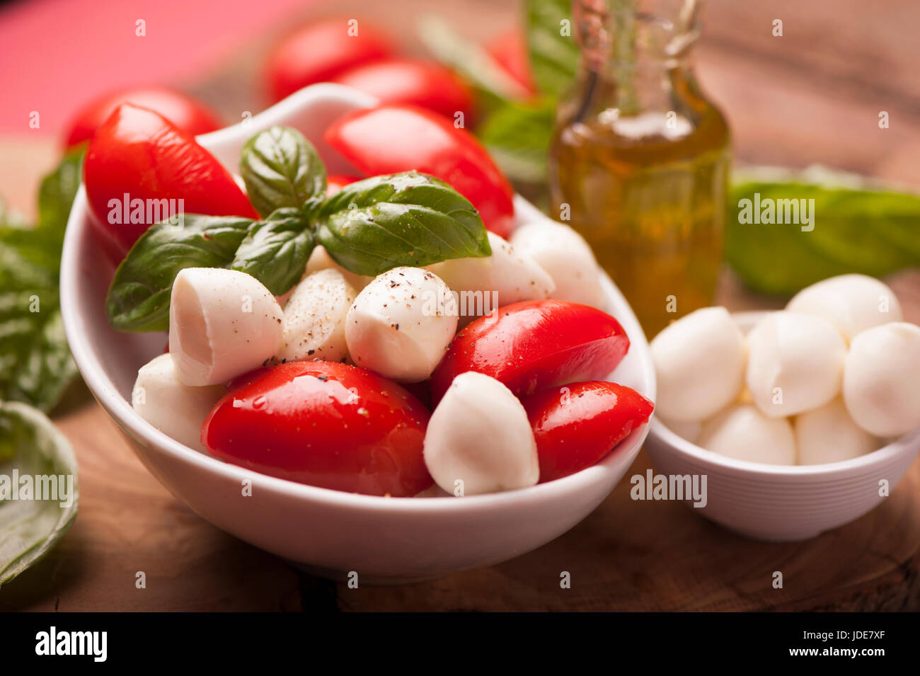 Caprese salad with baby mozzarella cheese Stock Photo - Alamy