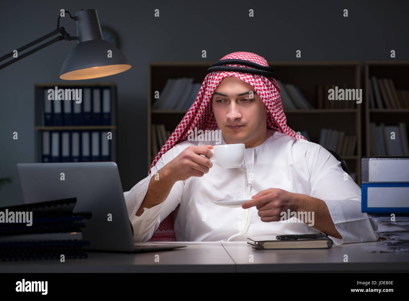 Arab businessman working late in office Stock Photo - Alamy