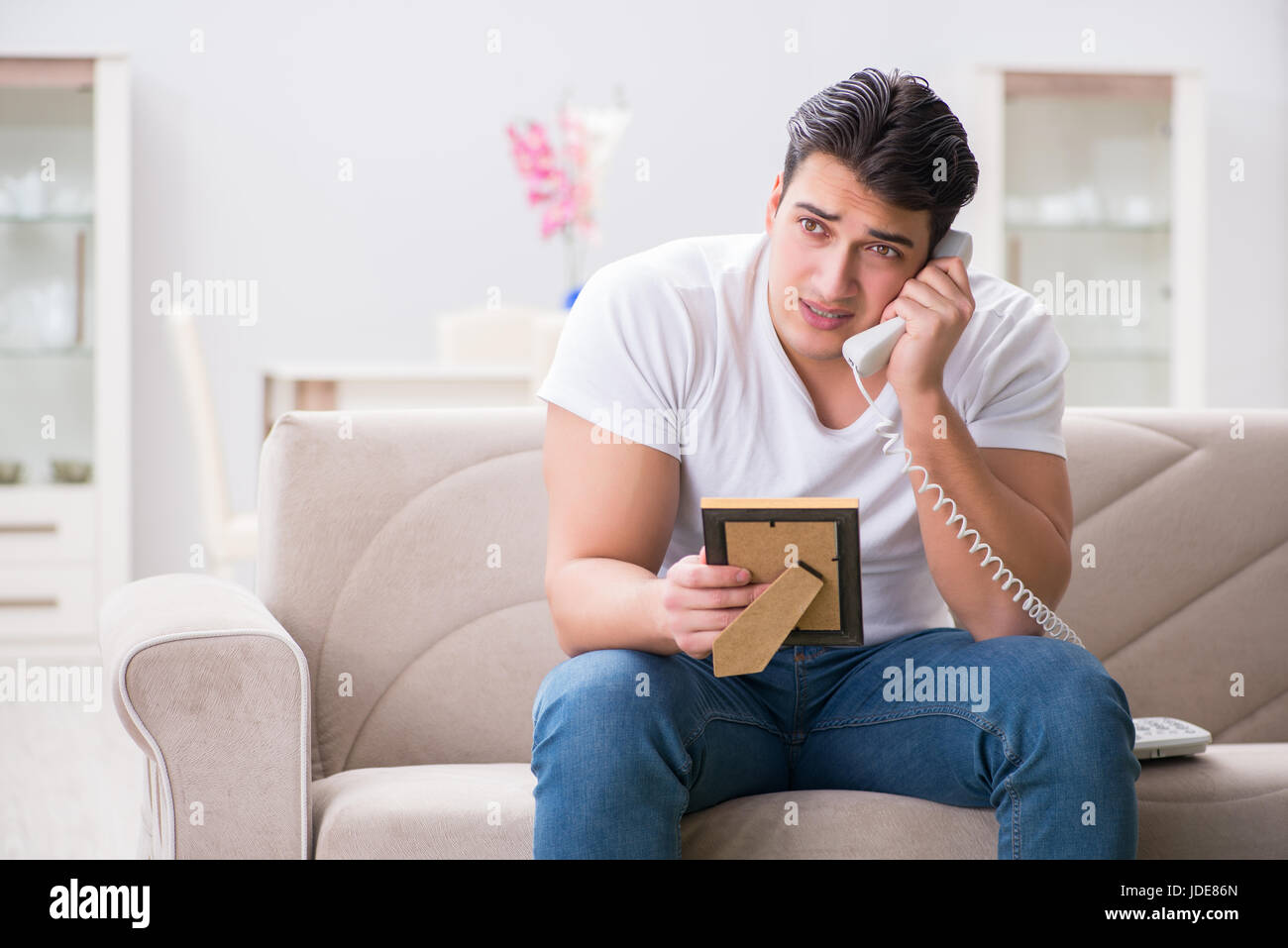 Young man in sad saint valentine concept Stock Photo - Alamy
