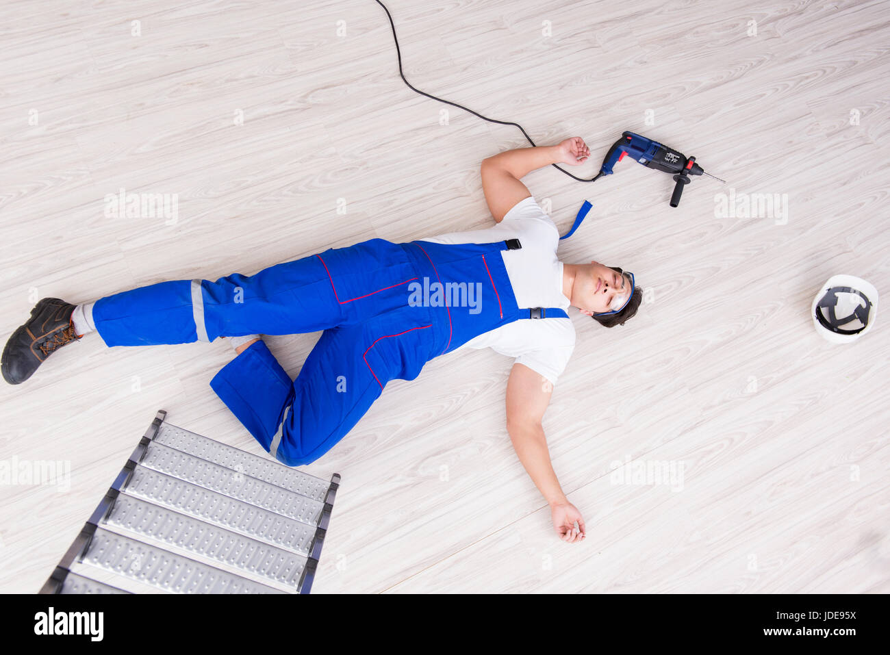 Worker after falling from height - unsafe behavior Stock Photo - Alamy