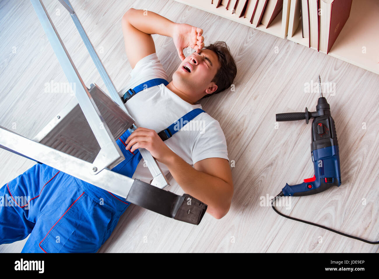 Unsafe behavior concept with falling worker Stock Photo - Alamy