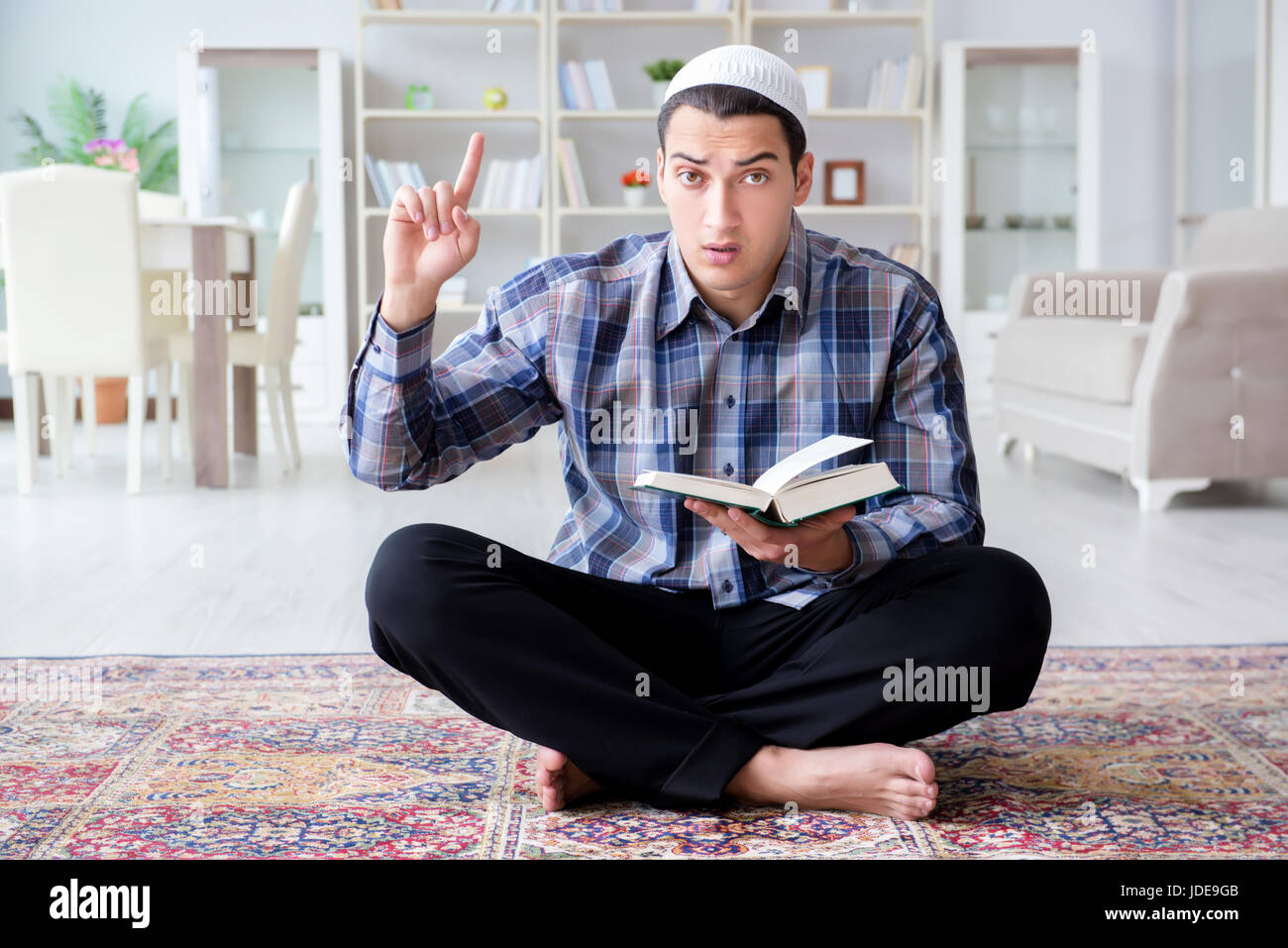 Muslim man praying at home Stock Photo - Alamy