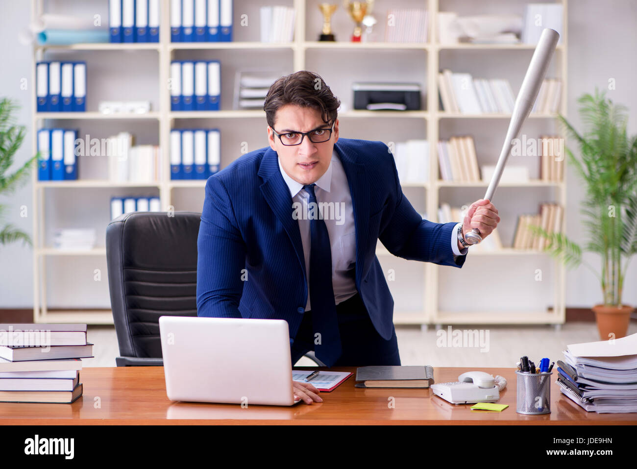 Angry aggressive businessman in the office Stock Photo - Alamy