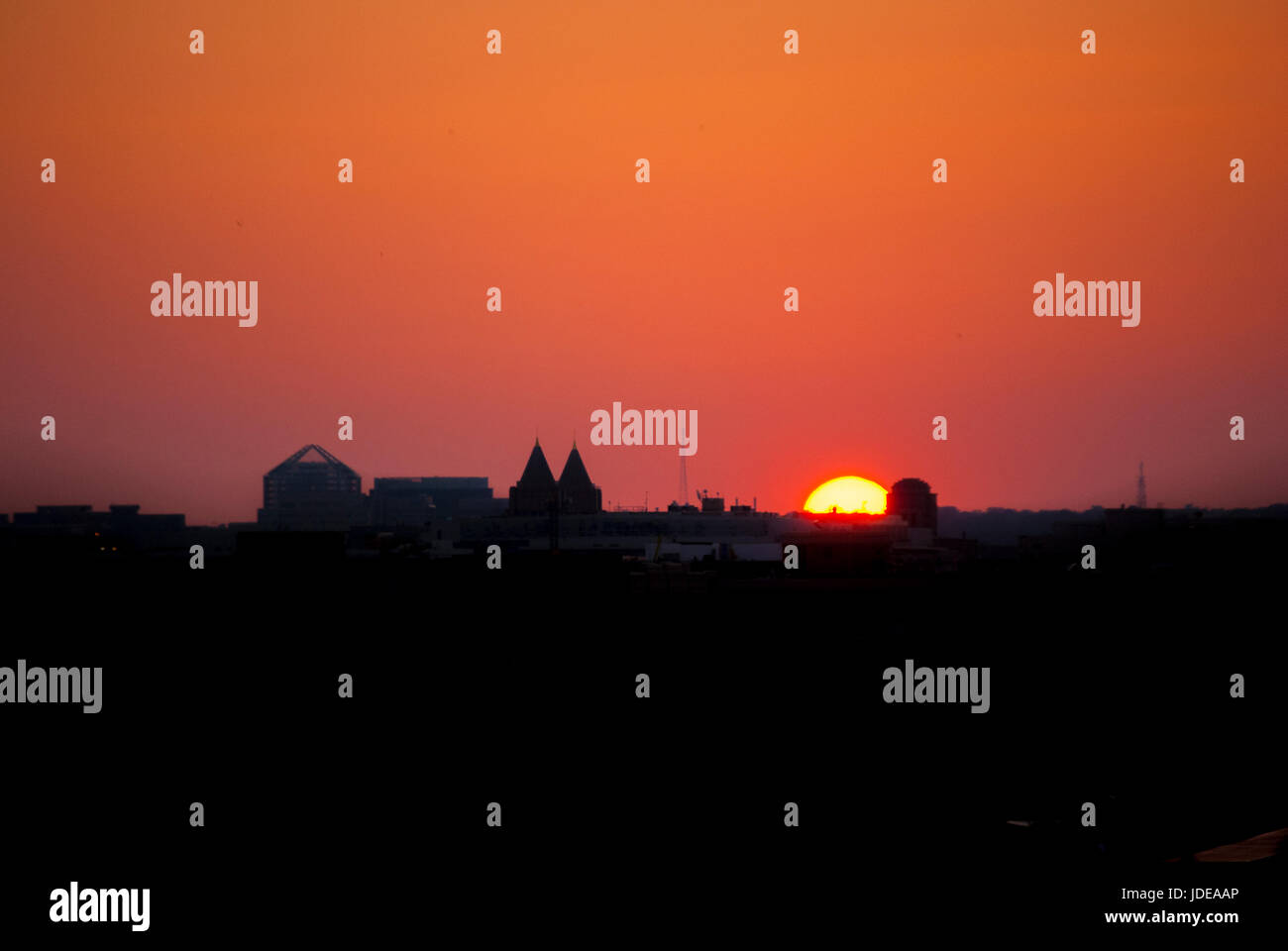 Sunset behind the skyline of city buildings in DC Stock Photo - Alamy