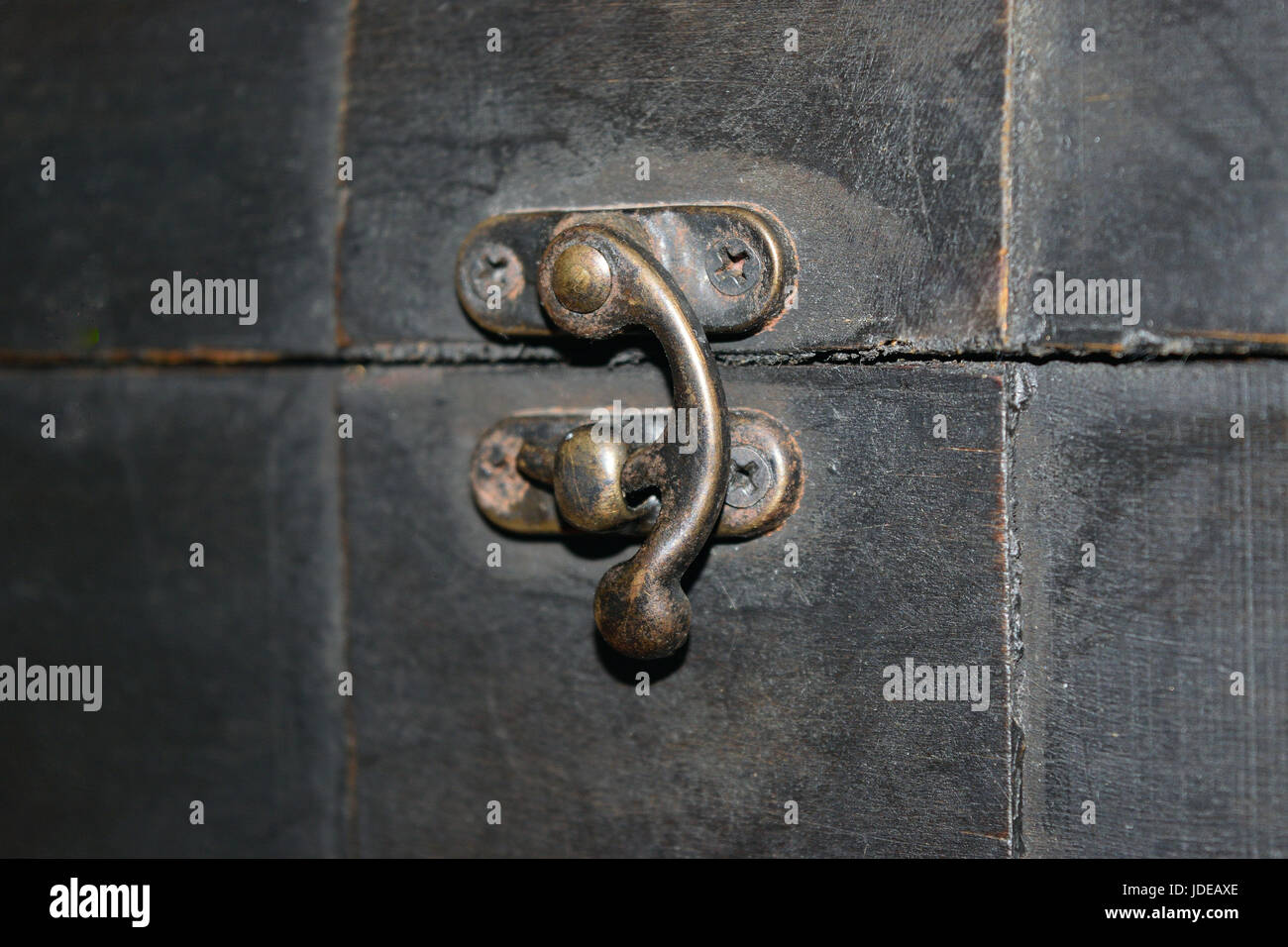 Brass closing hook of a secret casket box Stock Photo - Alamy