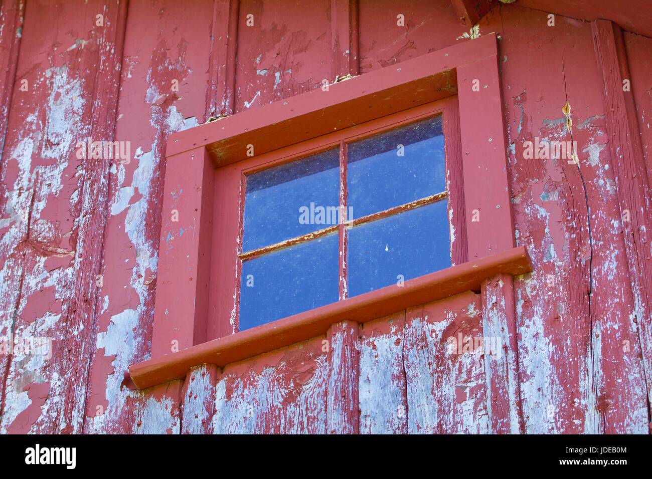 Pane window in red barn Stock Photo - Alamy
