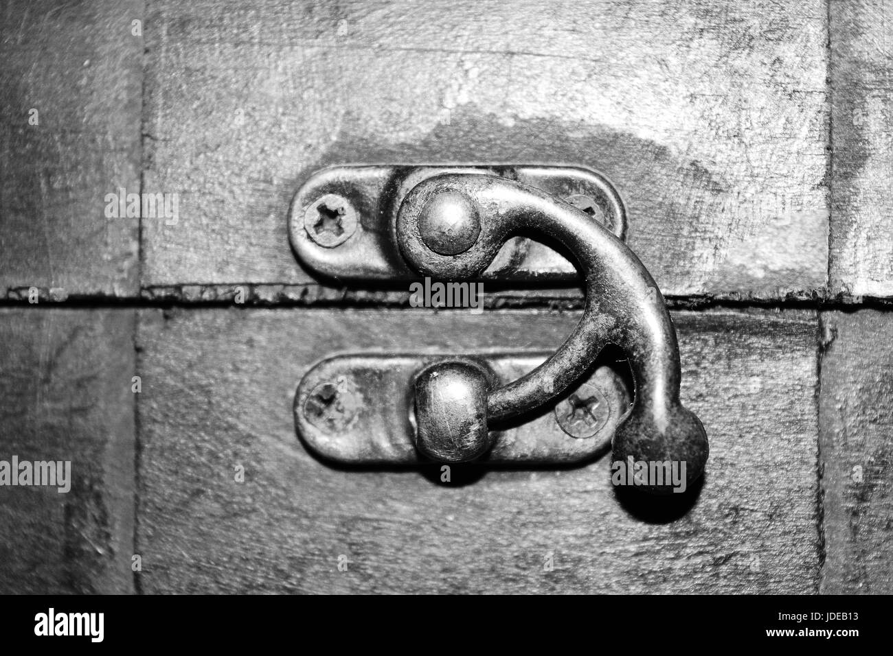 Brass closing hook of a secret casket box Stock Photo - Alamy