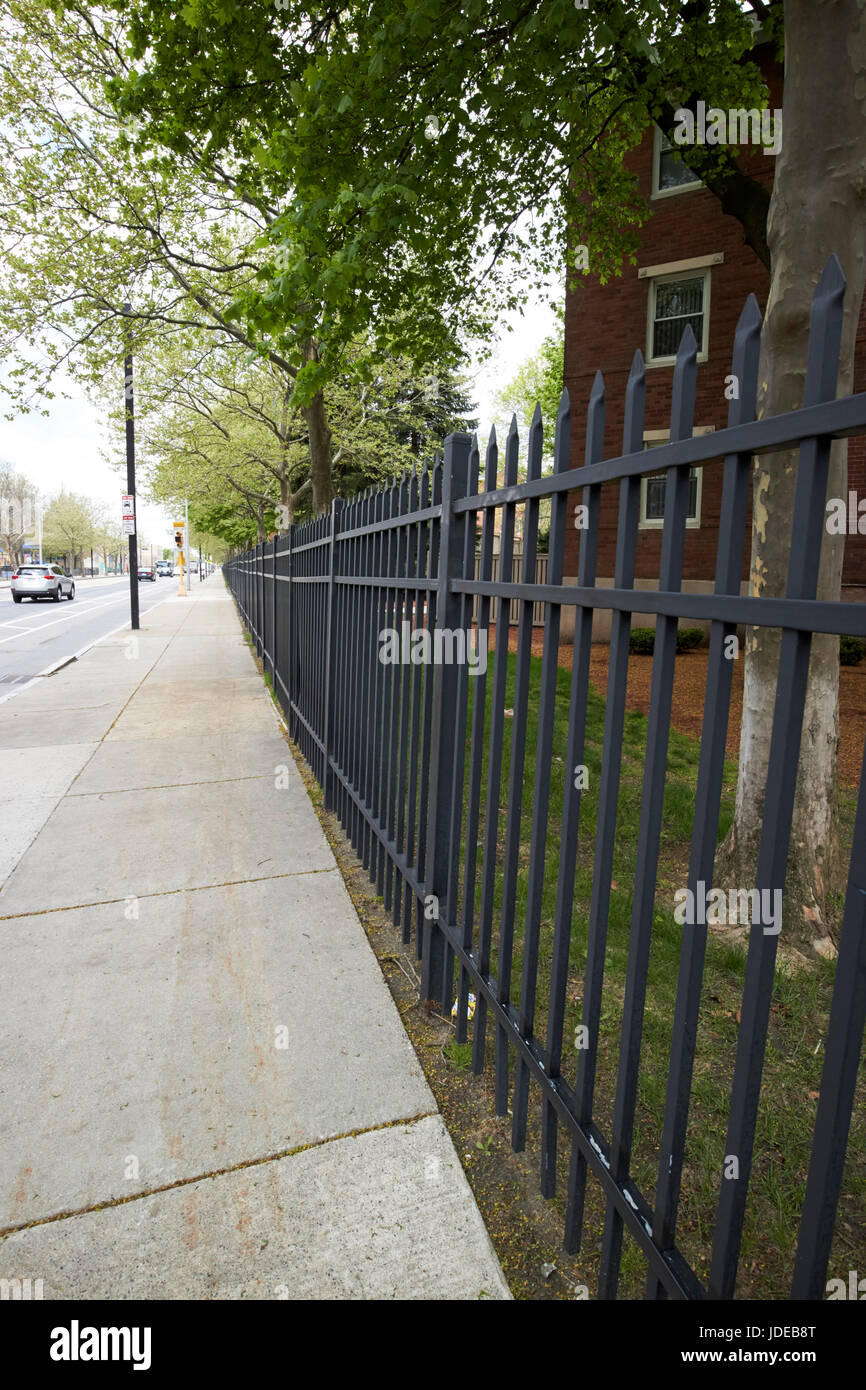exterior enclosing metal fence residents only housing complex Boston ...