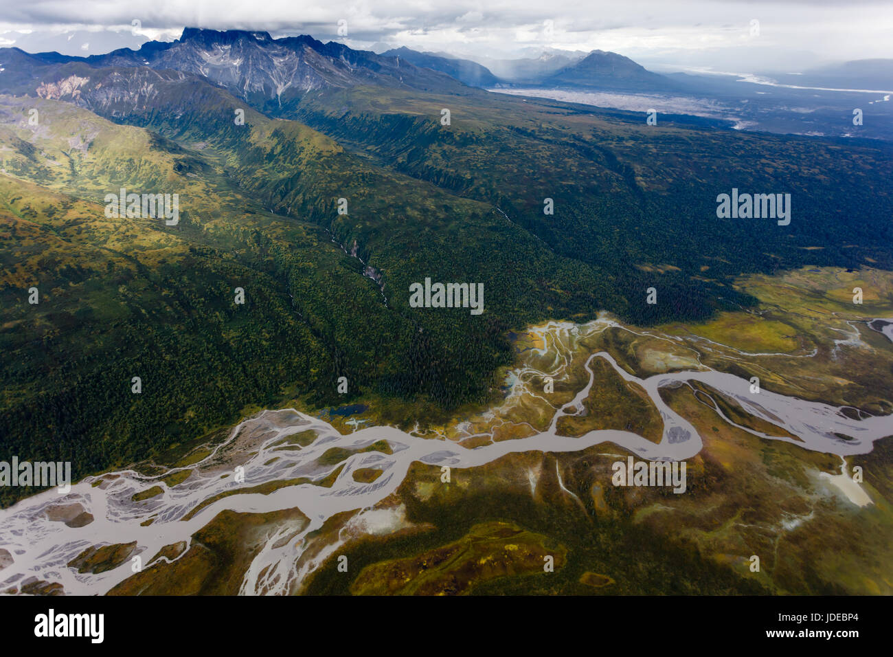 Winding braided river and mountains dominate Alaska landscape rich with ...