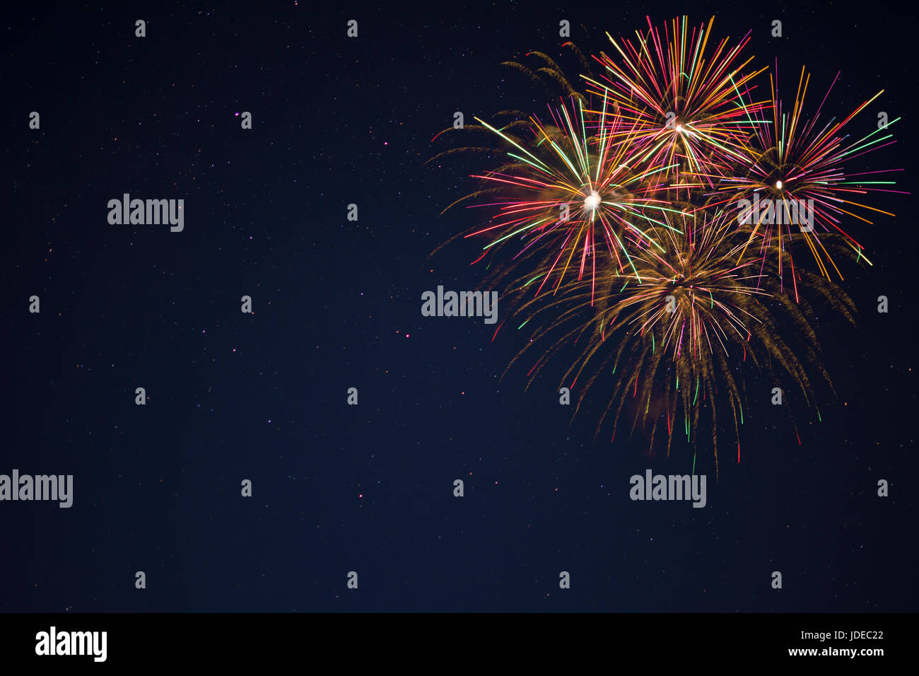 Amazing golden red green celebration fireworks located right side over ...