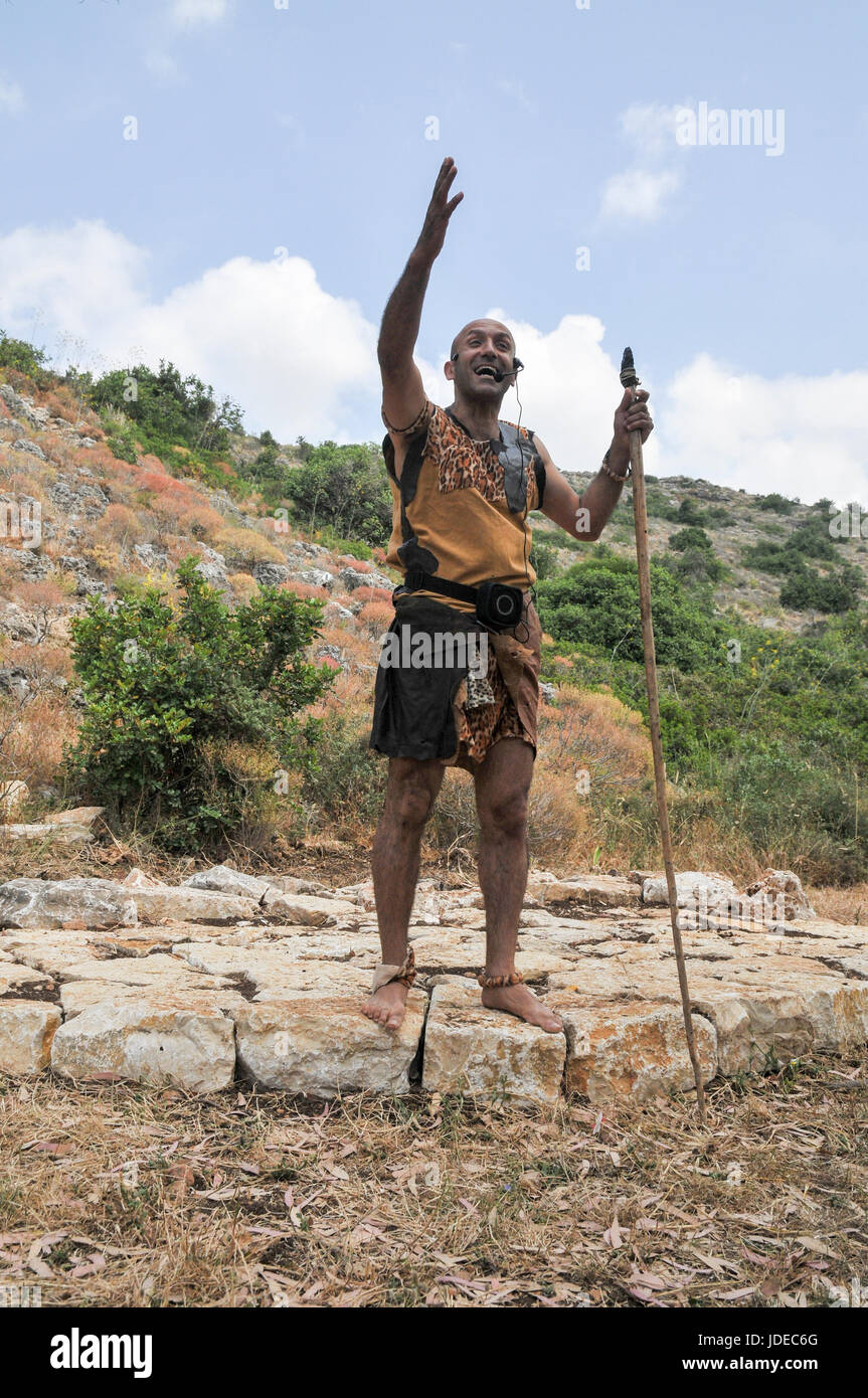 Actor portrays a caveman at the of the prehistoric cave at Carmel ...
