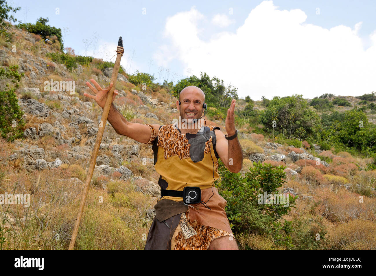Actor portrays a caveman at the of the prehistoric cave at Carmel ...
