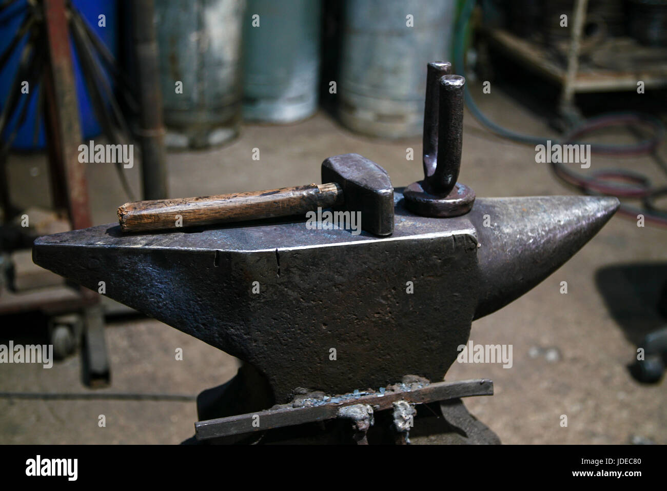 tool of the smith, hammer and anvill in a forge Stock Photo - Alamy