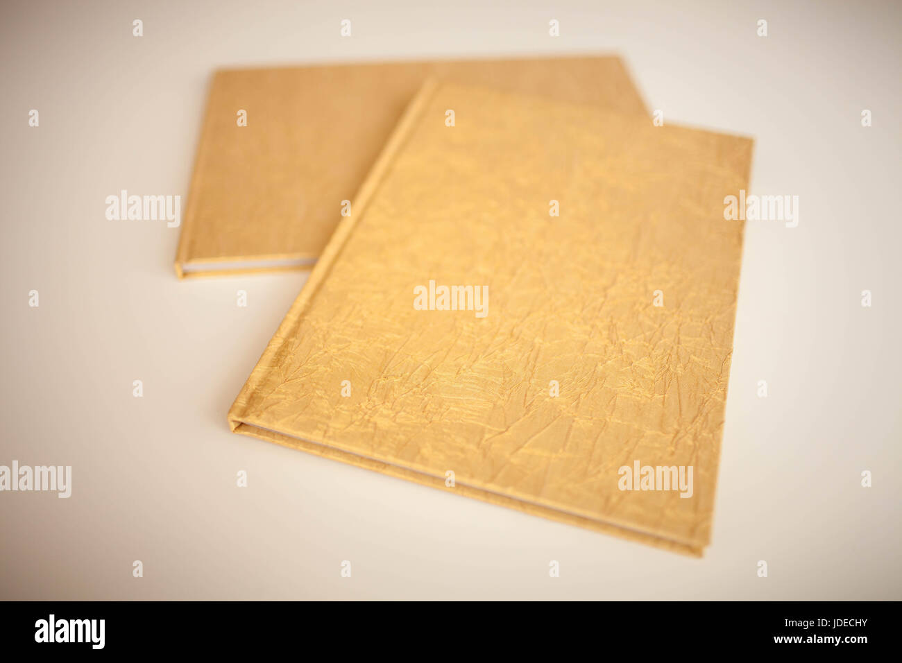Photo album Golden color with a textile cover Stock Photo - Alamy