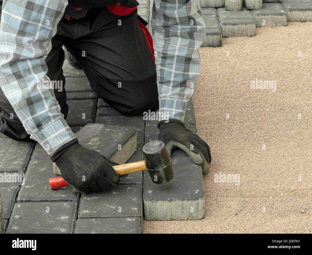 Paver laying driveway pavement out of concrete pavement blocks Stock ...