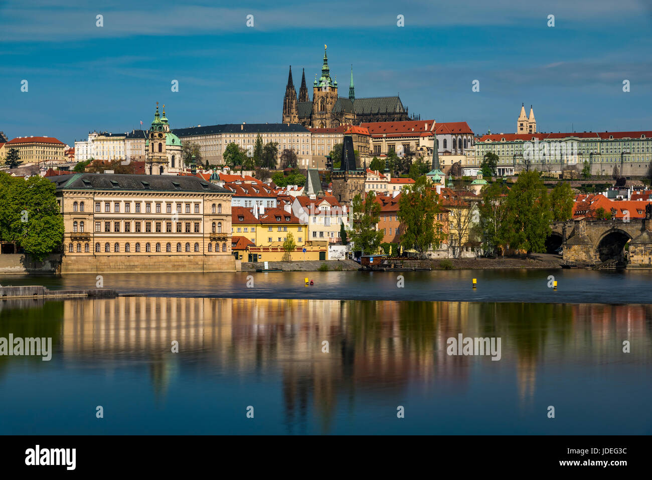 View of Mala Strana district with St. Vitus cathedral reflected in the ...