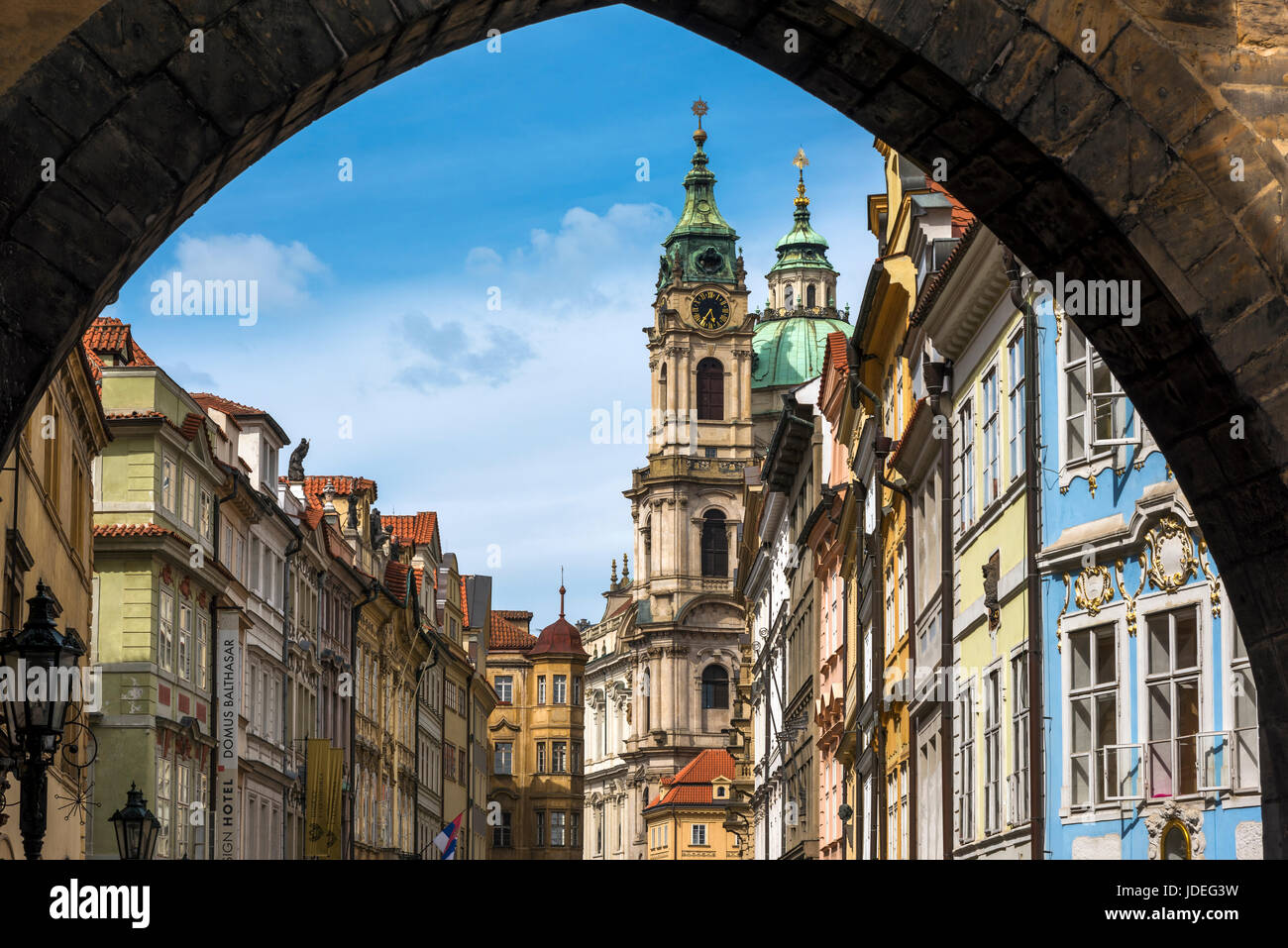St. Nicholas Church and colorful historic buildings in Mala Strana ...