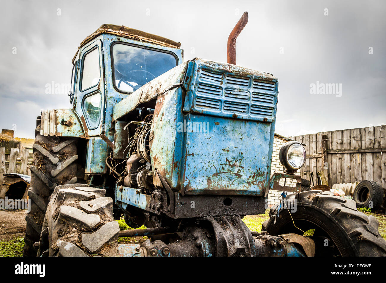 Old dirty tractor in farm hi-res stock photography and images - Alamy