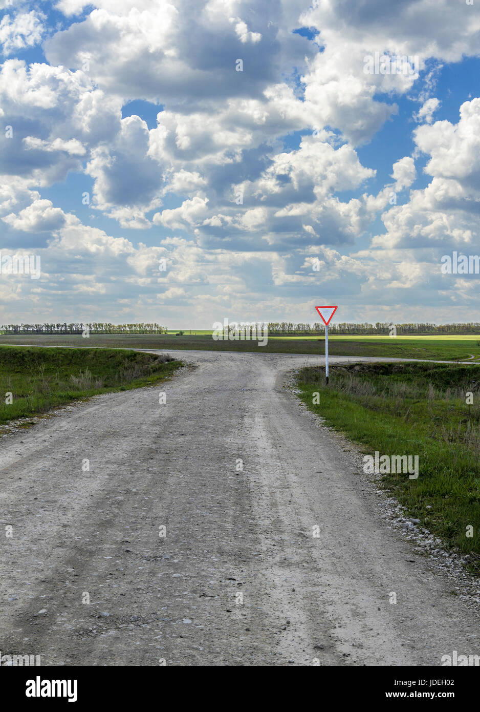 Crossroads rural roads and main against the blue sky Stock Photo - Alamy