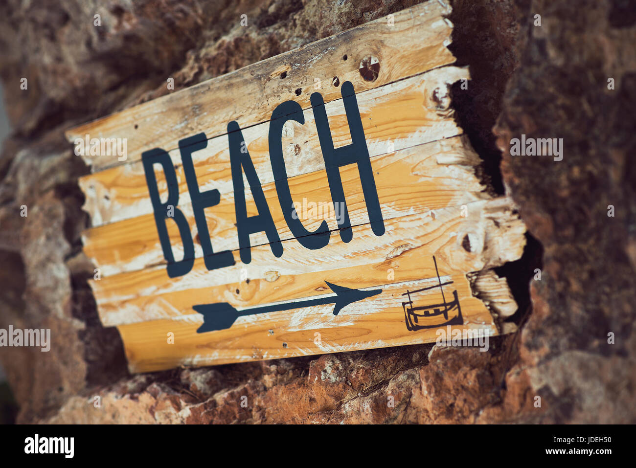 Wooden beach sign in Ibiza Stock Photo - Alamy