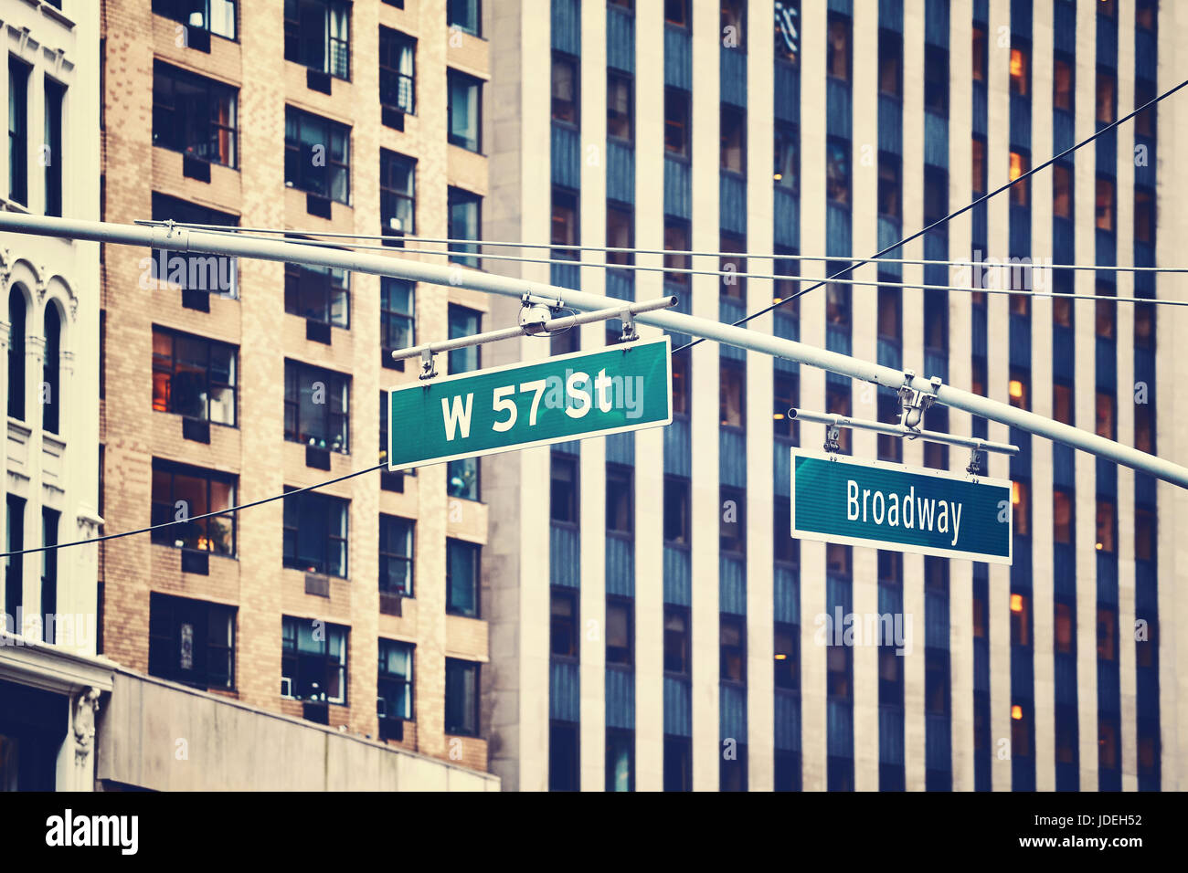 Vintage toned West 57 Street and Broadway hanging signs in Manhattan ...