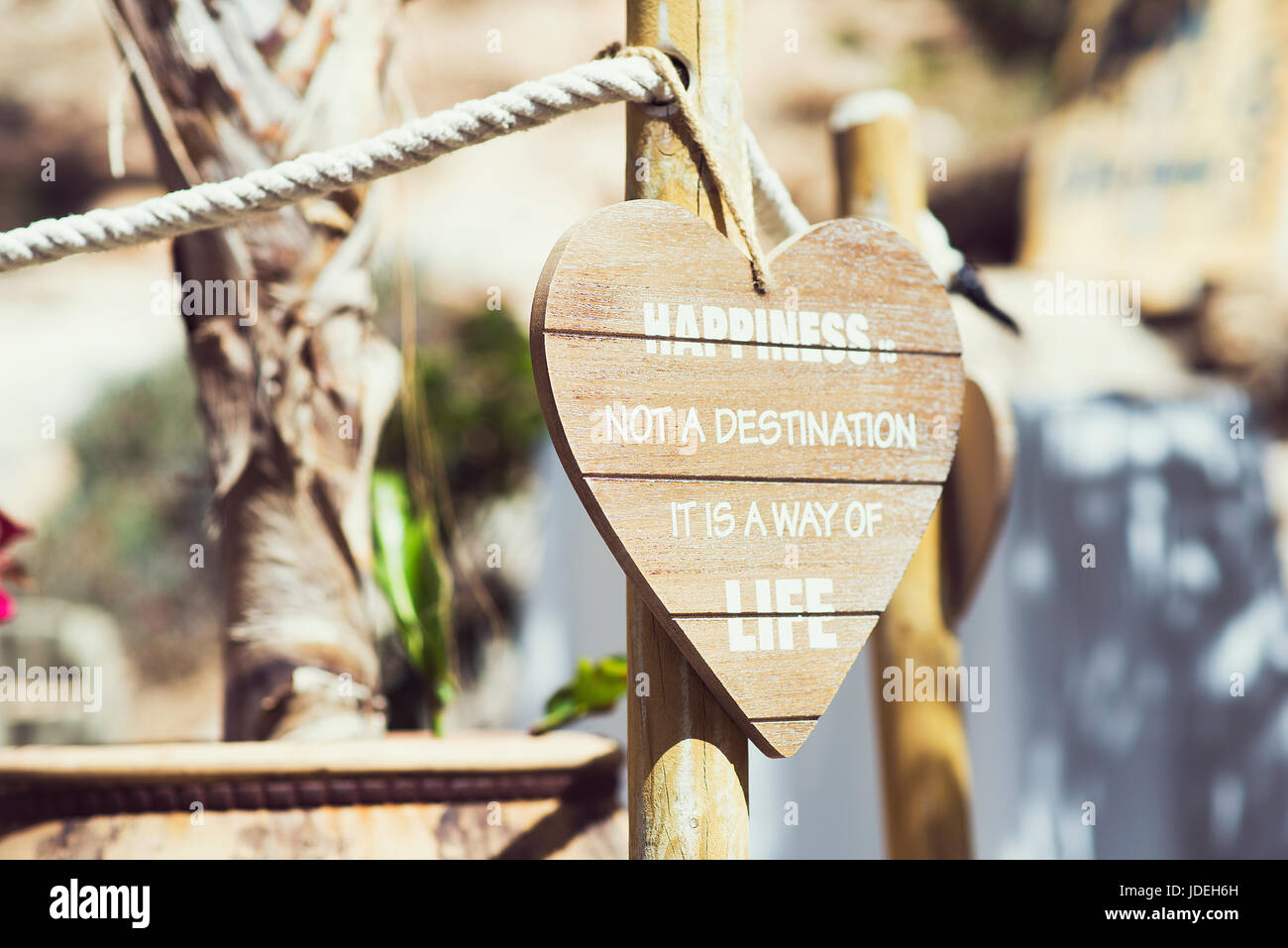 Happiness wooden sign in the sun Stock Photo - Alamy
