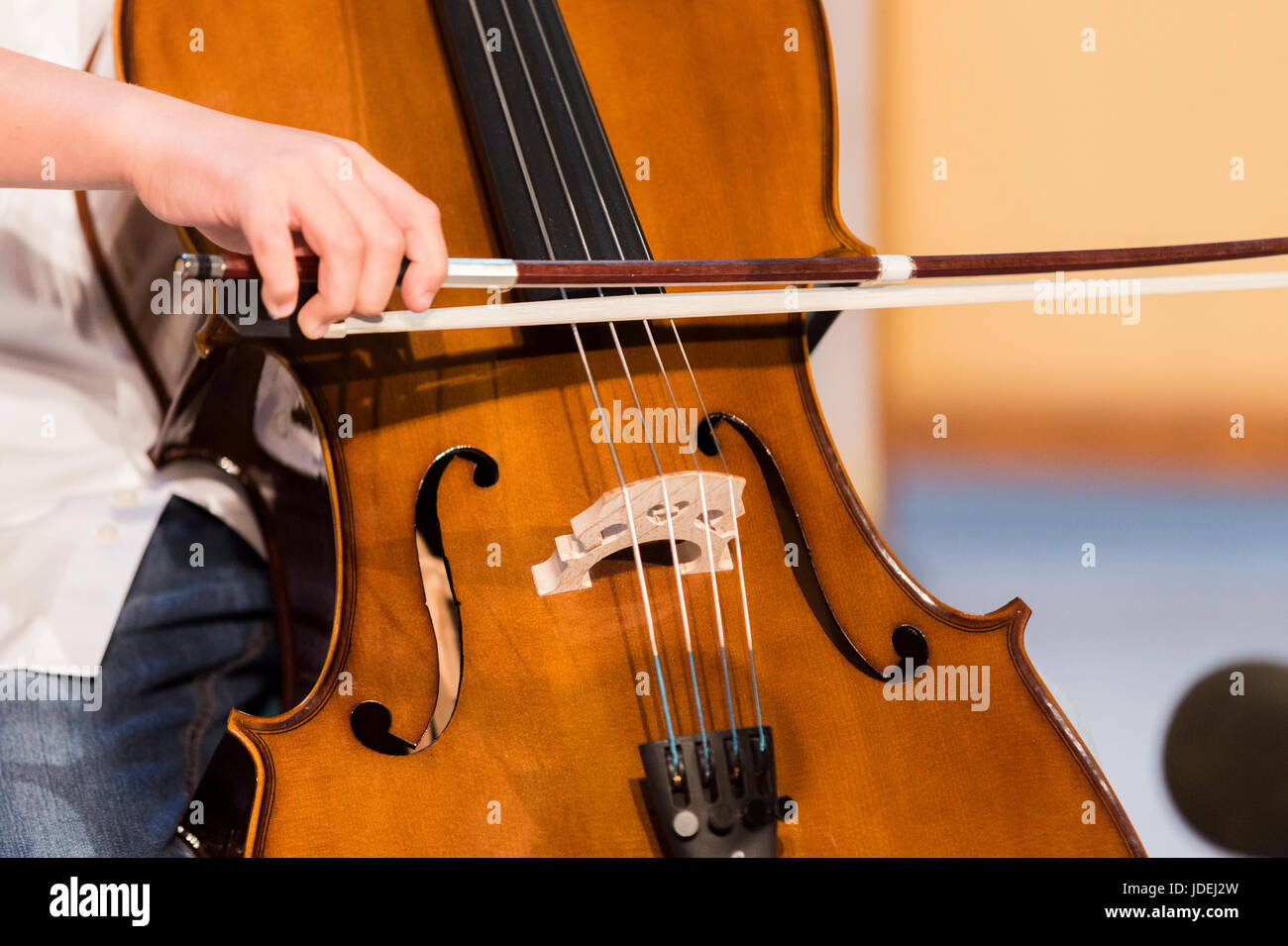 Boy playing cello hi-res stock photography and images - Alamy