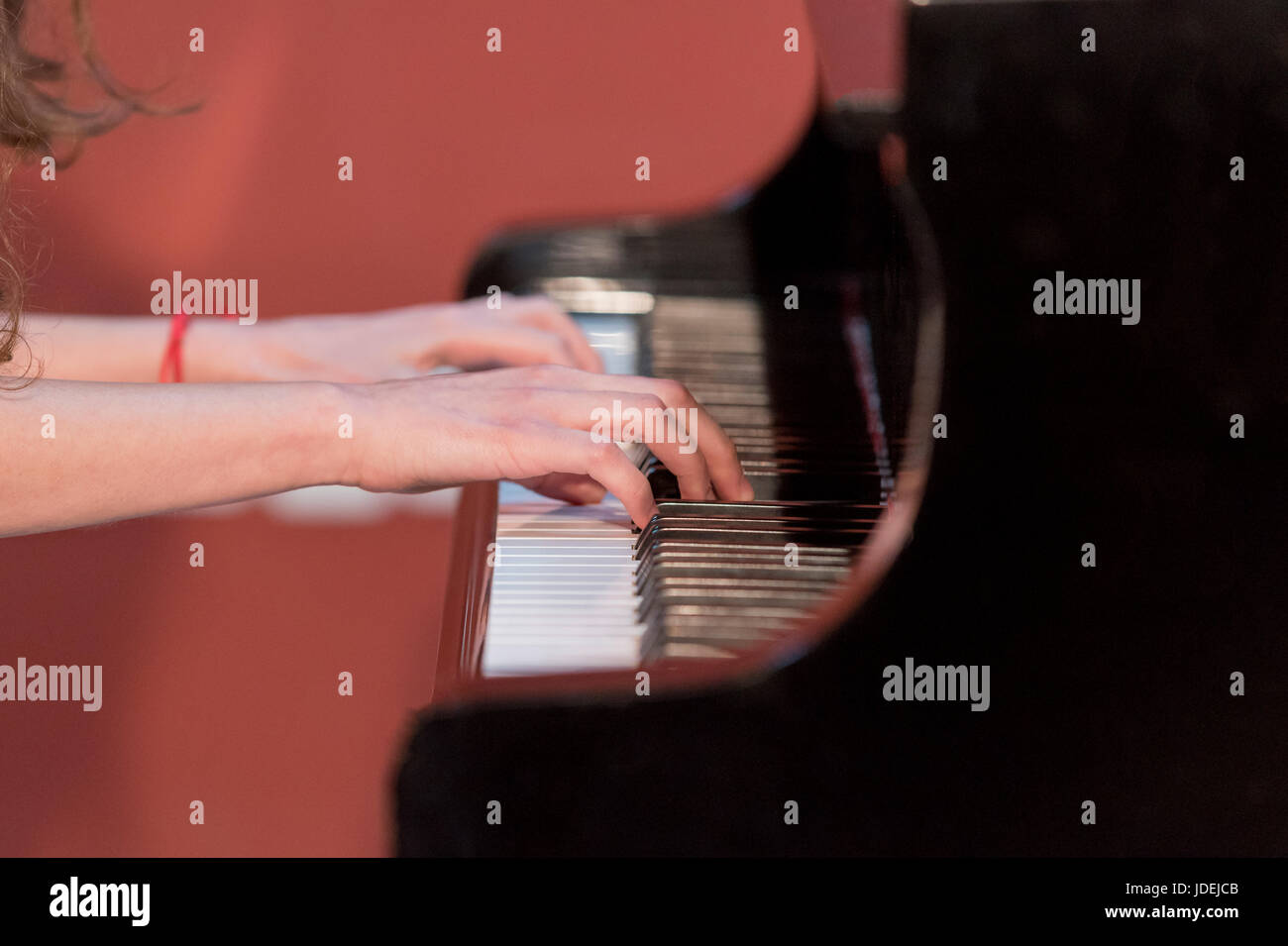 Young female piano player hi-res stock photography and images - Alamy