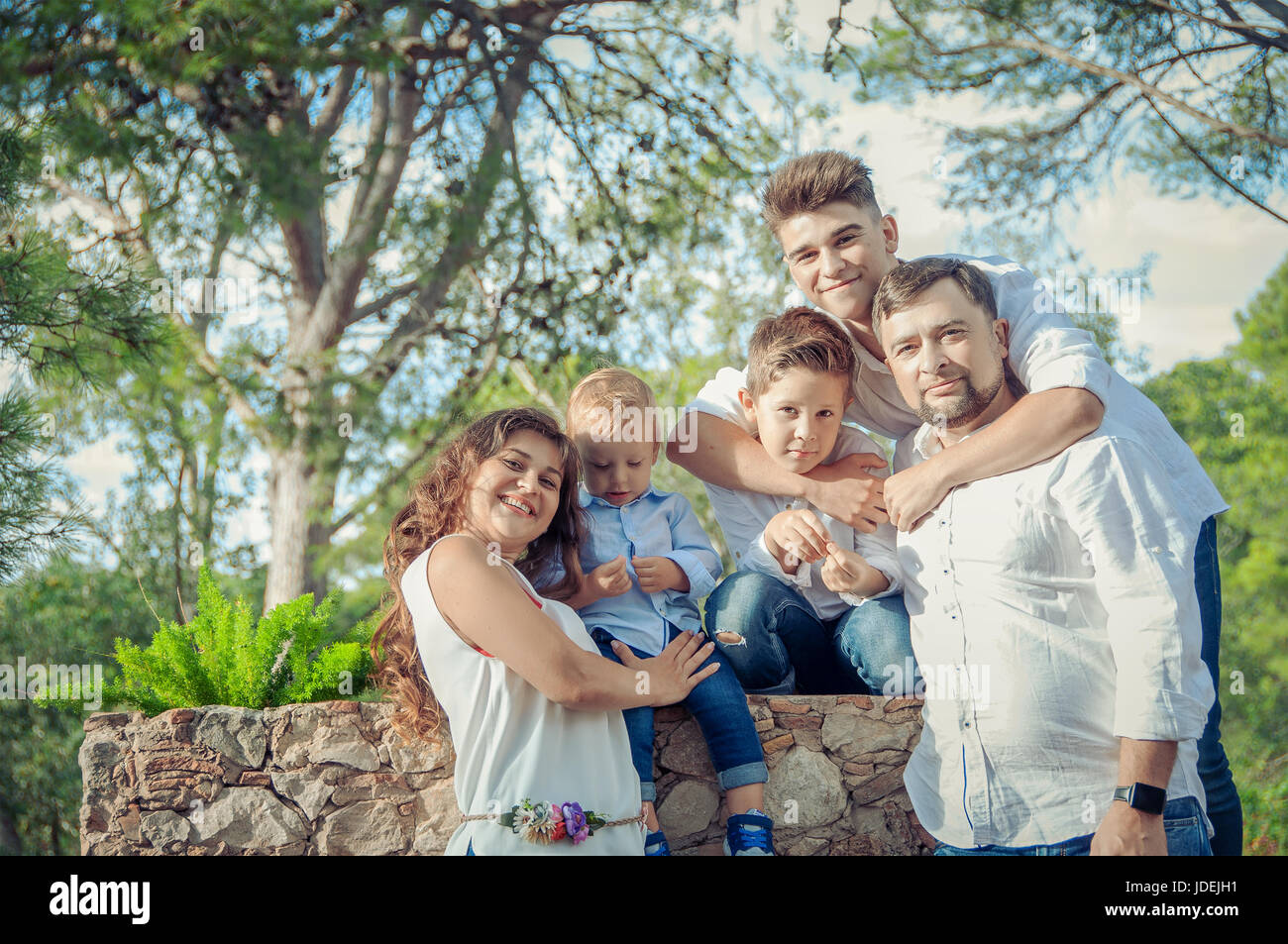 Portrait of a happy family in the park. Family concepts Stock Photo - Alamy