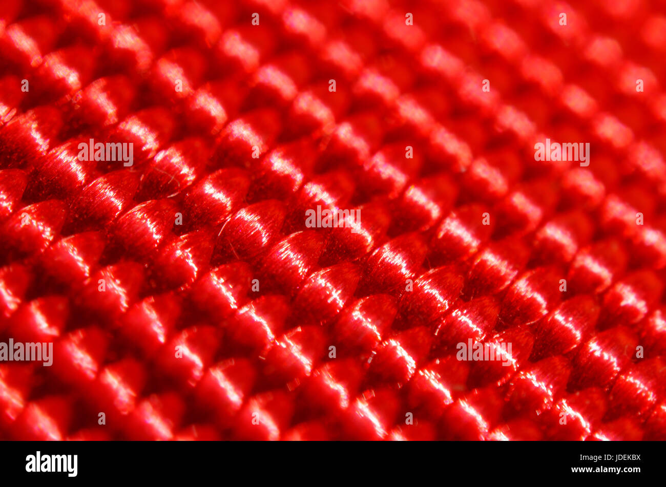 Red nylon belt close-up. Shallow depth of field. The interweaving of ...