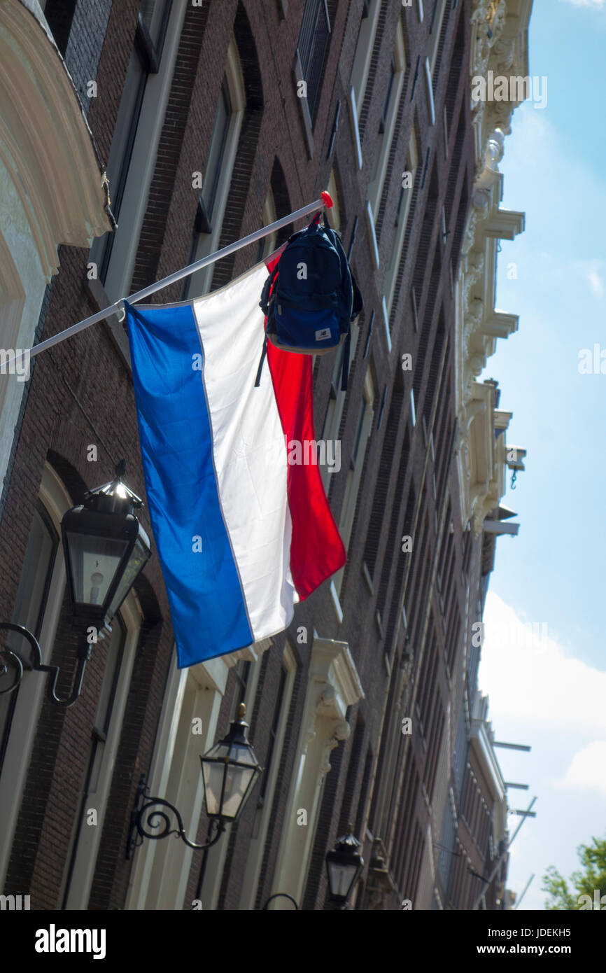 A dutch flag with a school bag in top to celebrate graduation Stock ...