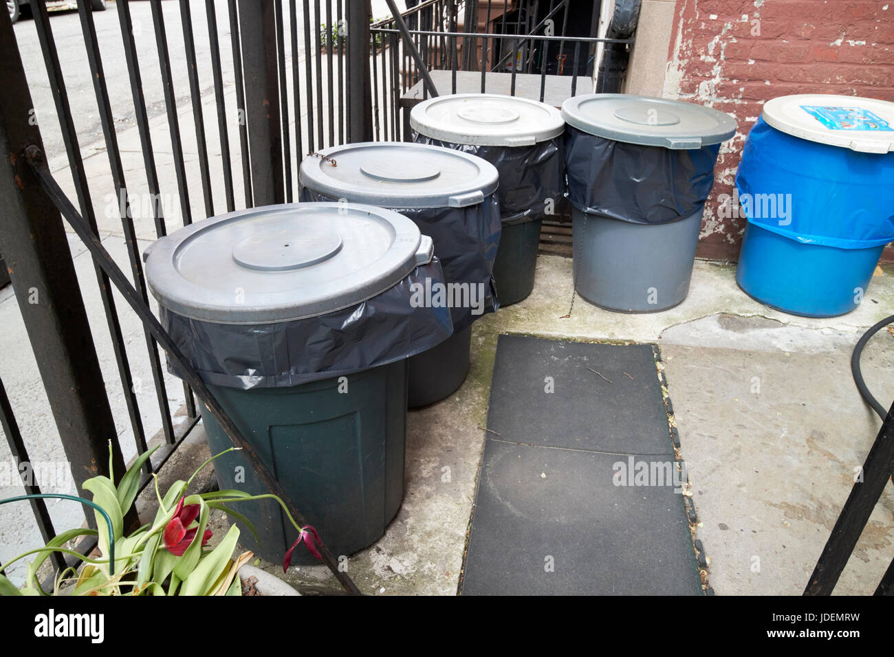 Bins outside apartment building hi-res stock photography and images - Alamy