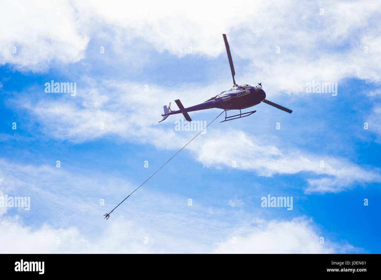 helicopter carry sand for construction industry Stock Photo - Alamy