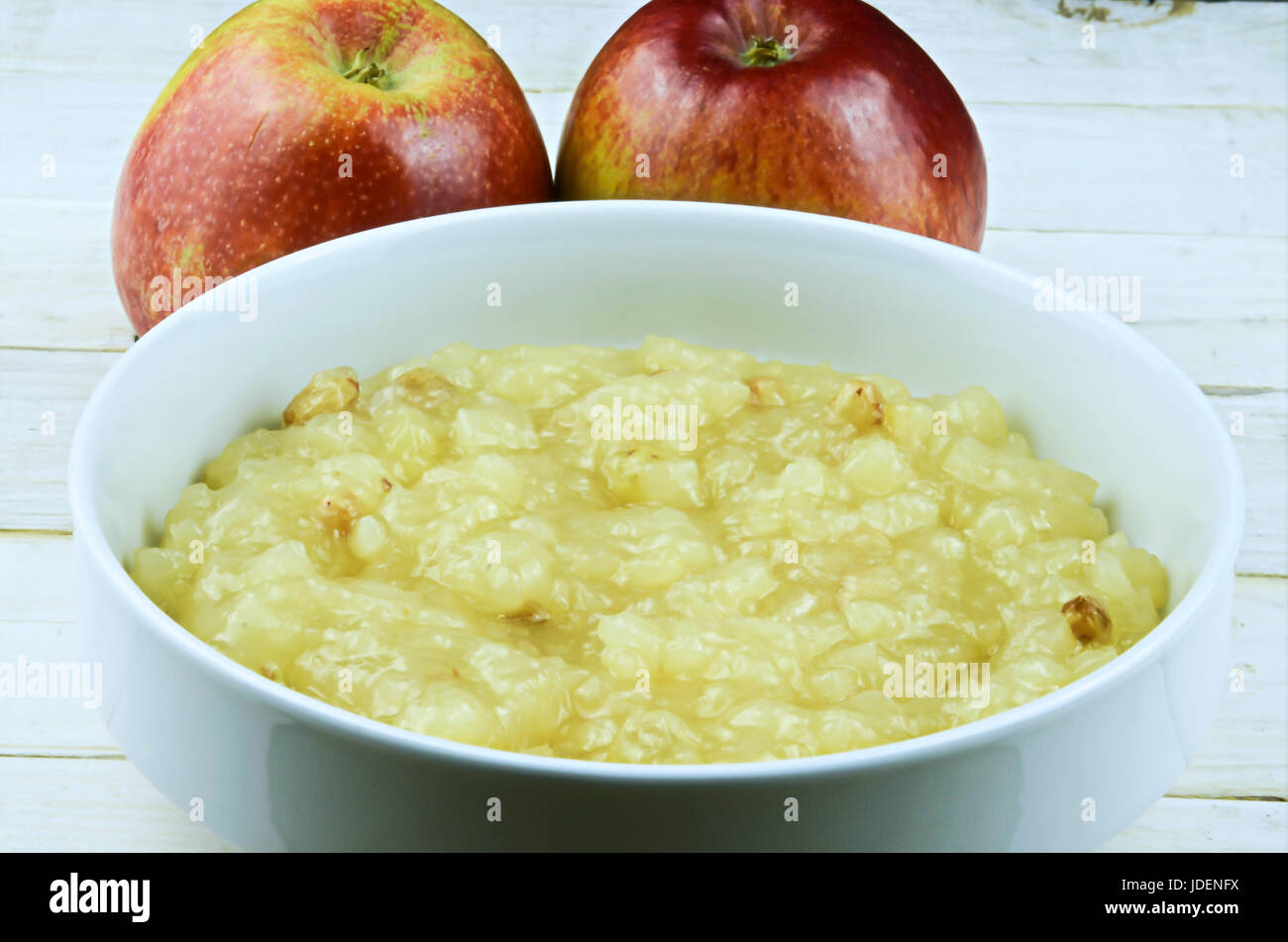 Fresh AppleSauce against background with two apple Stock Photo - Alamy