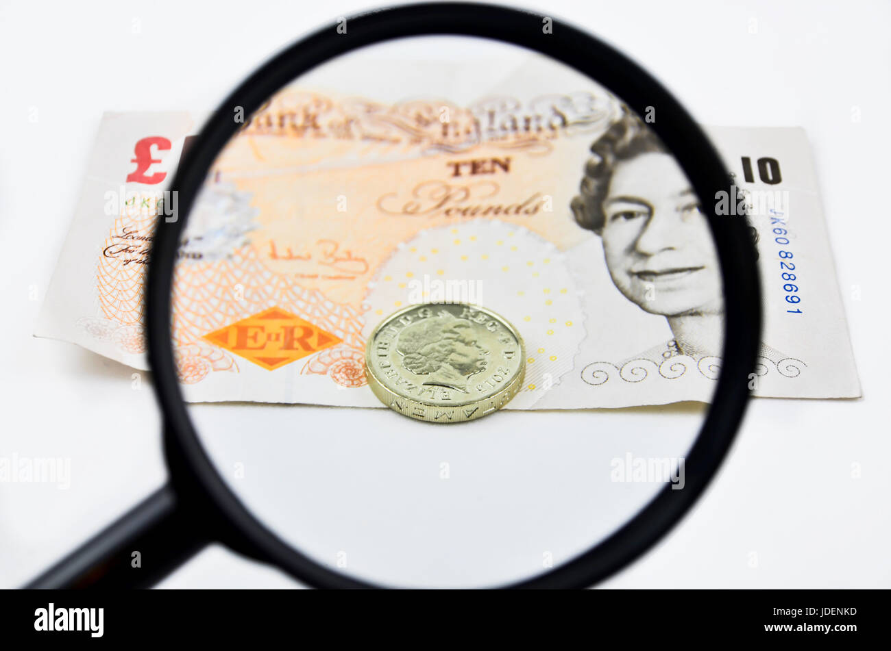 British banknotes and coin view by magnifier Stock Photo - Alamy
