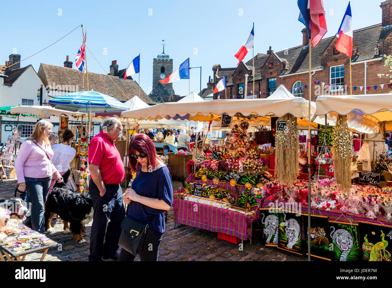 People wandering around busy French market set up at Sandwich town ...