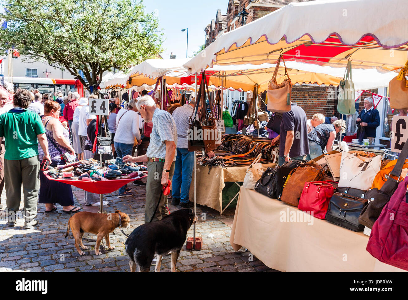 People wandering around busy French market set up at Sandwich town ...