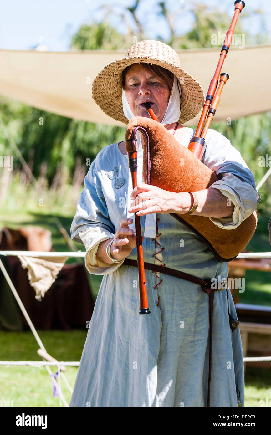 Medieval re-enactment event, mature woman, dressed as medieval minstrel ...