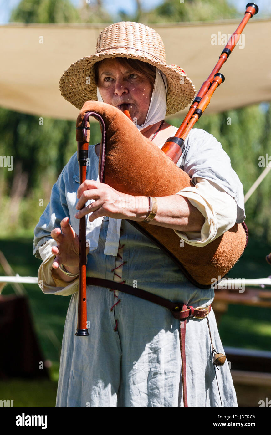 Medieval re-enactment event, mature woman, dressed as medieval minstrel ...